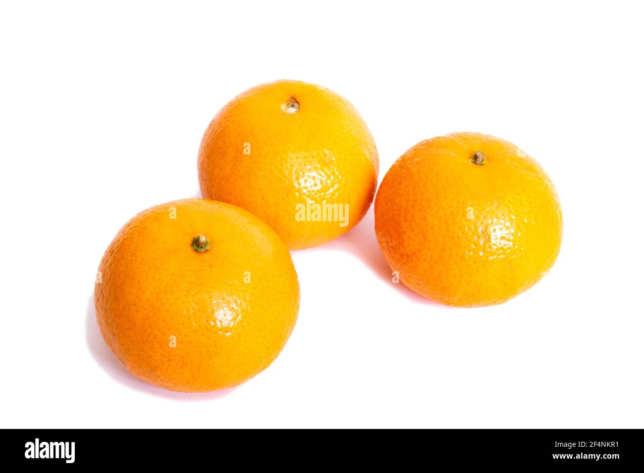 Three yellow tangerines isolated on white background close up Stock ...