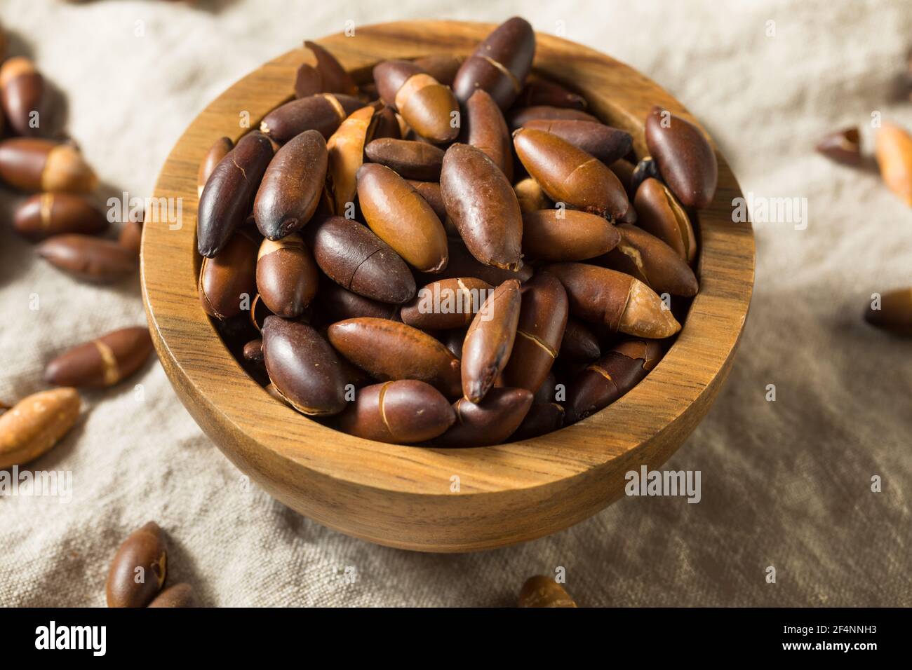 Raw Organic Brown Baru Nuts in a Bowl Stock Photo - Alamy