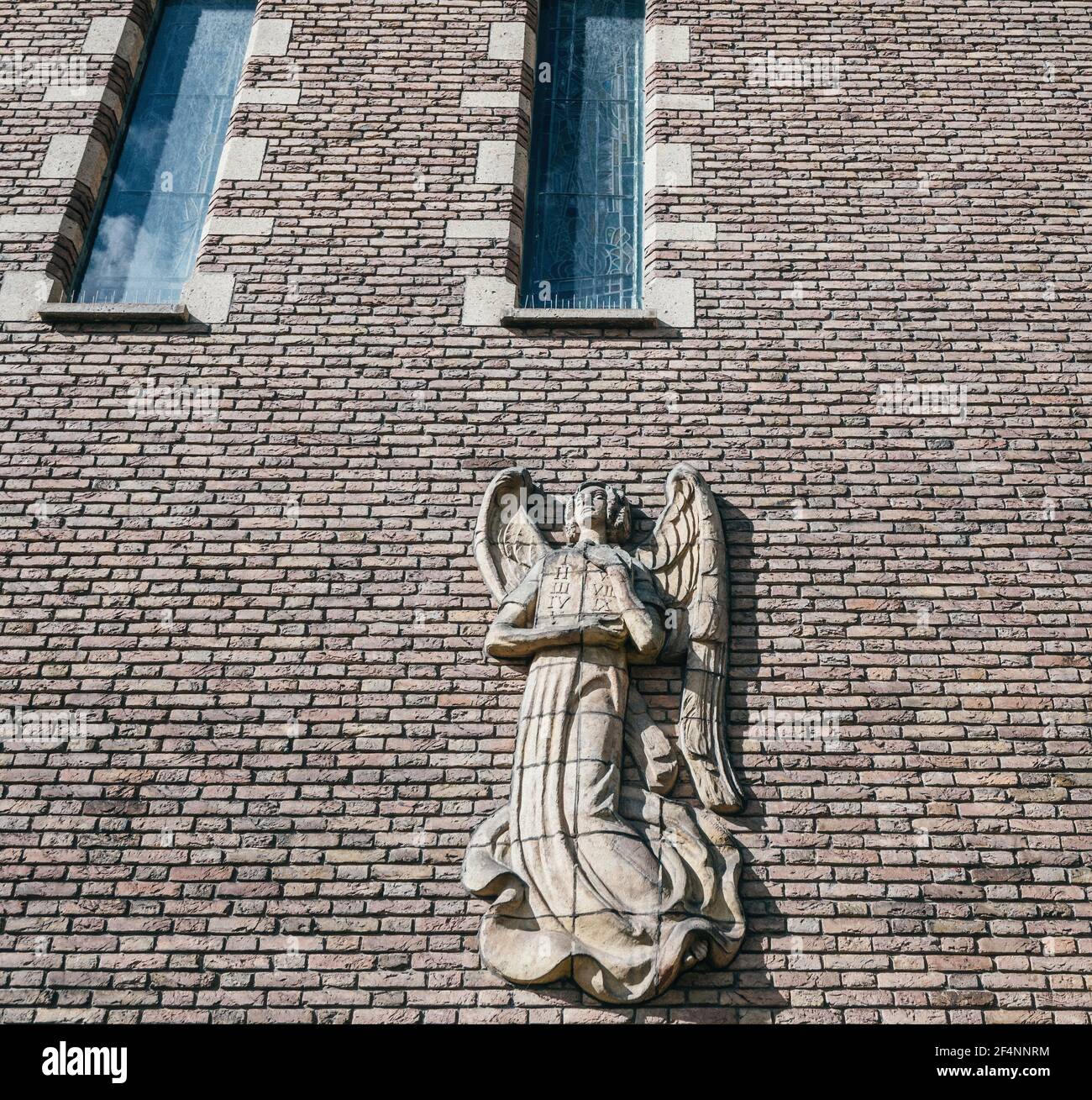 Angle with bible with roman numerals on the cover Stock Photo - Alamy