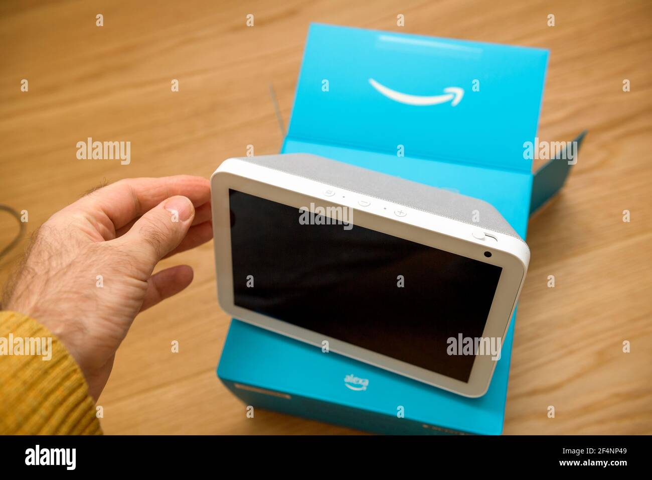 holding new Amazon Echo Show smart speaker that is part of the Amazon ...