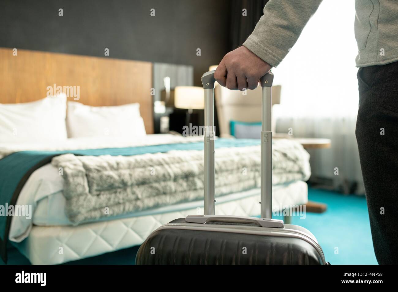 Male hotel suitcase bed hi-res stock photography and images - Alamy