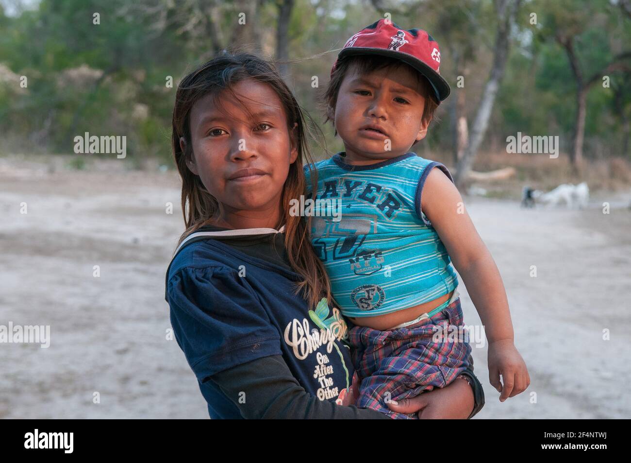 Chaco. Argentine. 15-01-2019. Indigenous girl carrying her small ...