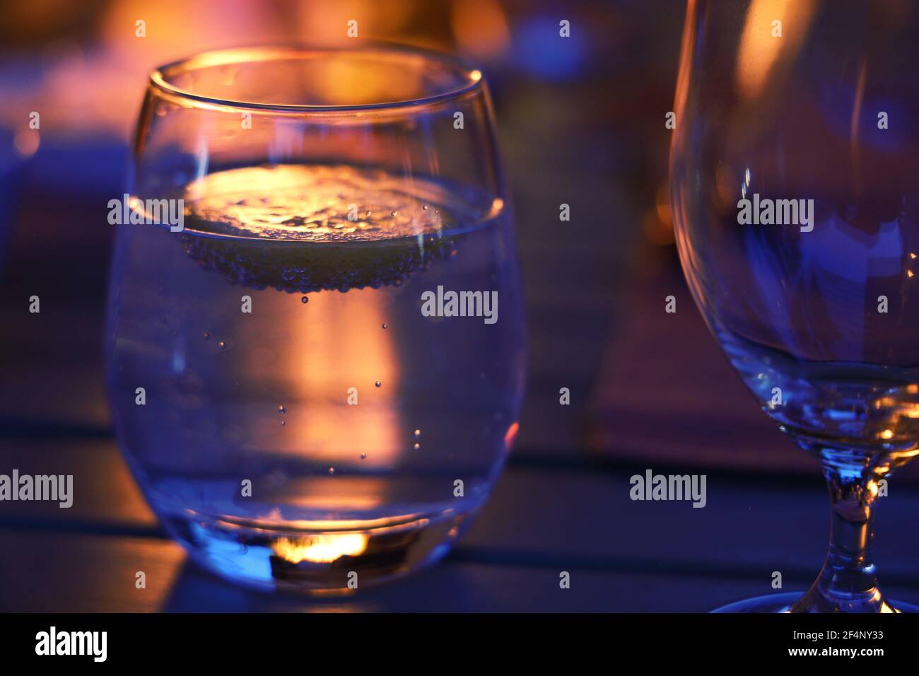 Glass in blue light Stock Photo - Alamy