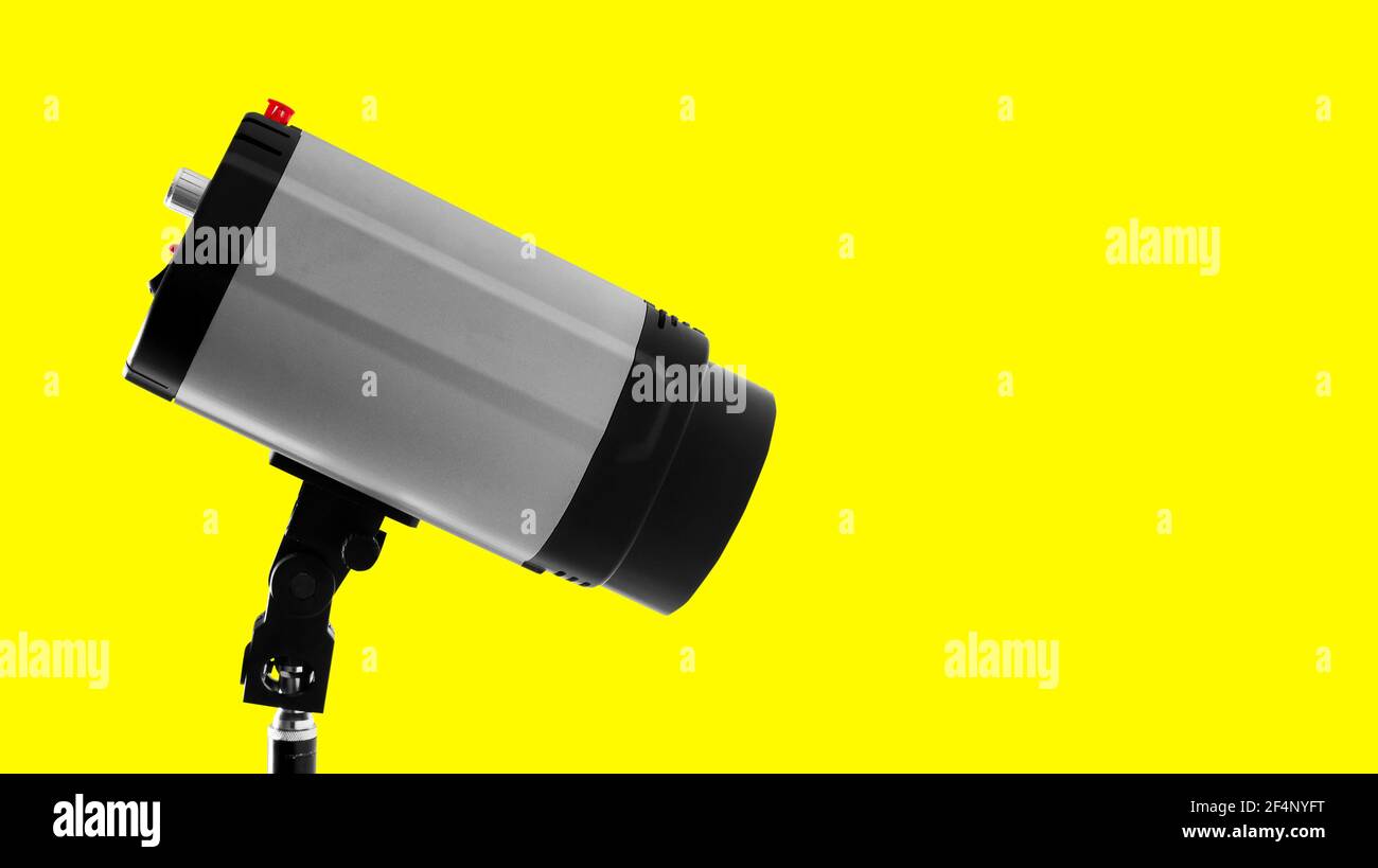 Studio strobe flash on the yellow Stock Photo - Alamy