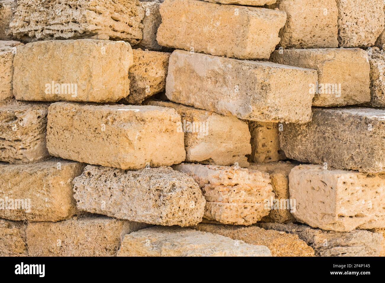 Heap of brick shell blocks sand stone texture background, close-up ...