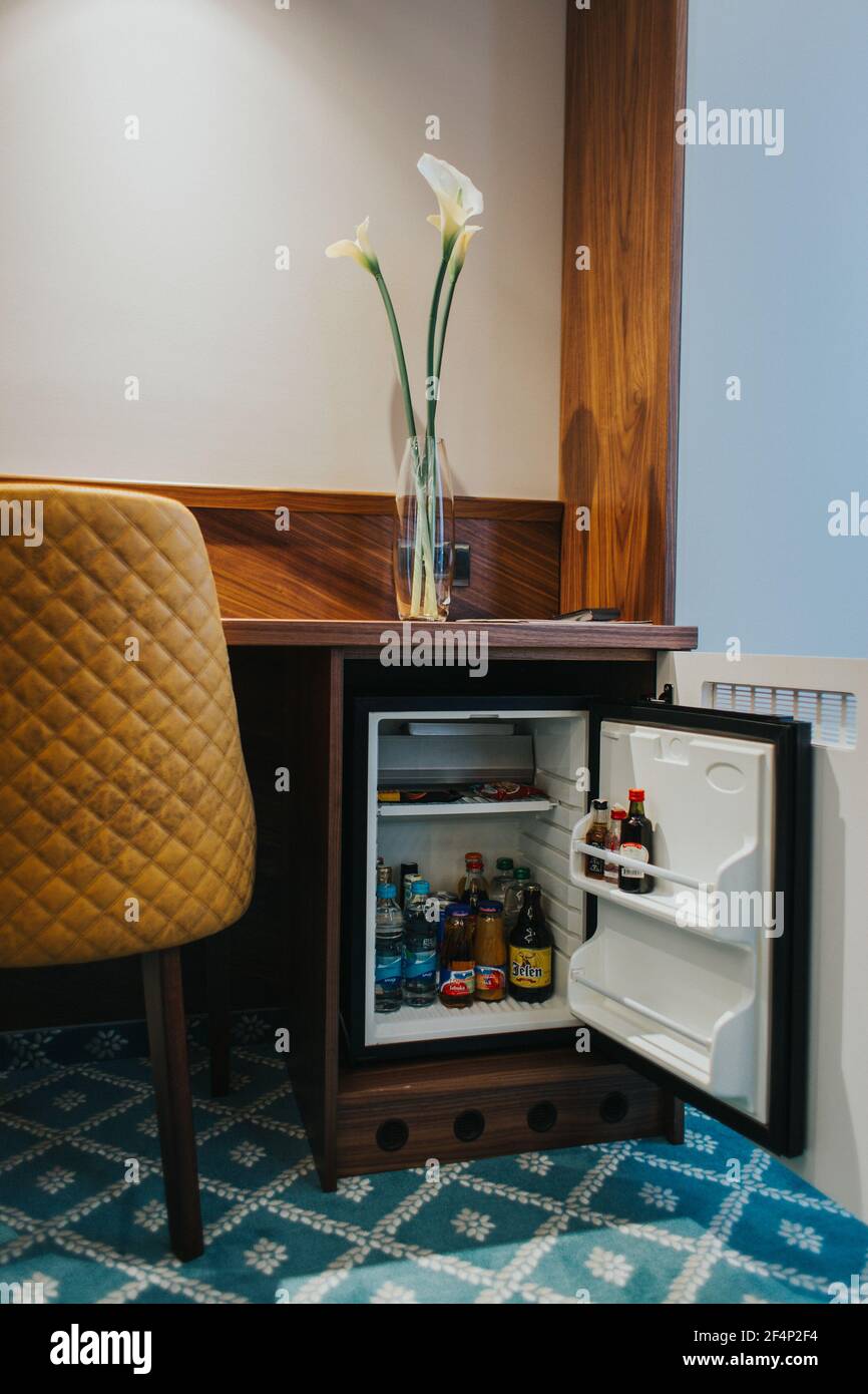 Vertical shot of a minibar under the desk of a hotel room Stock Photo ...