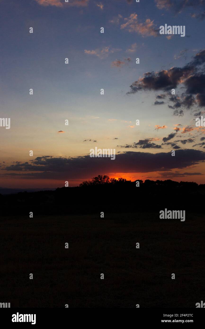 Backlit sunset with yellow, red and blue colors in southern Andalusia ...