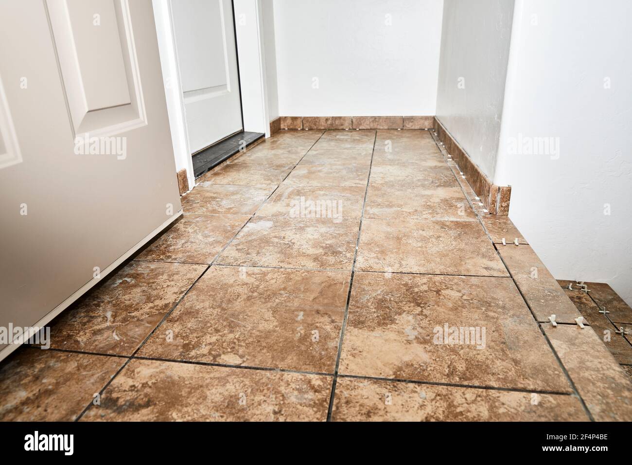 New tile installation on steps with a landing in preparation to be ...