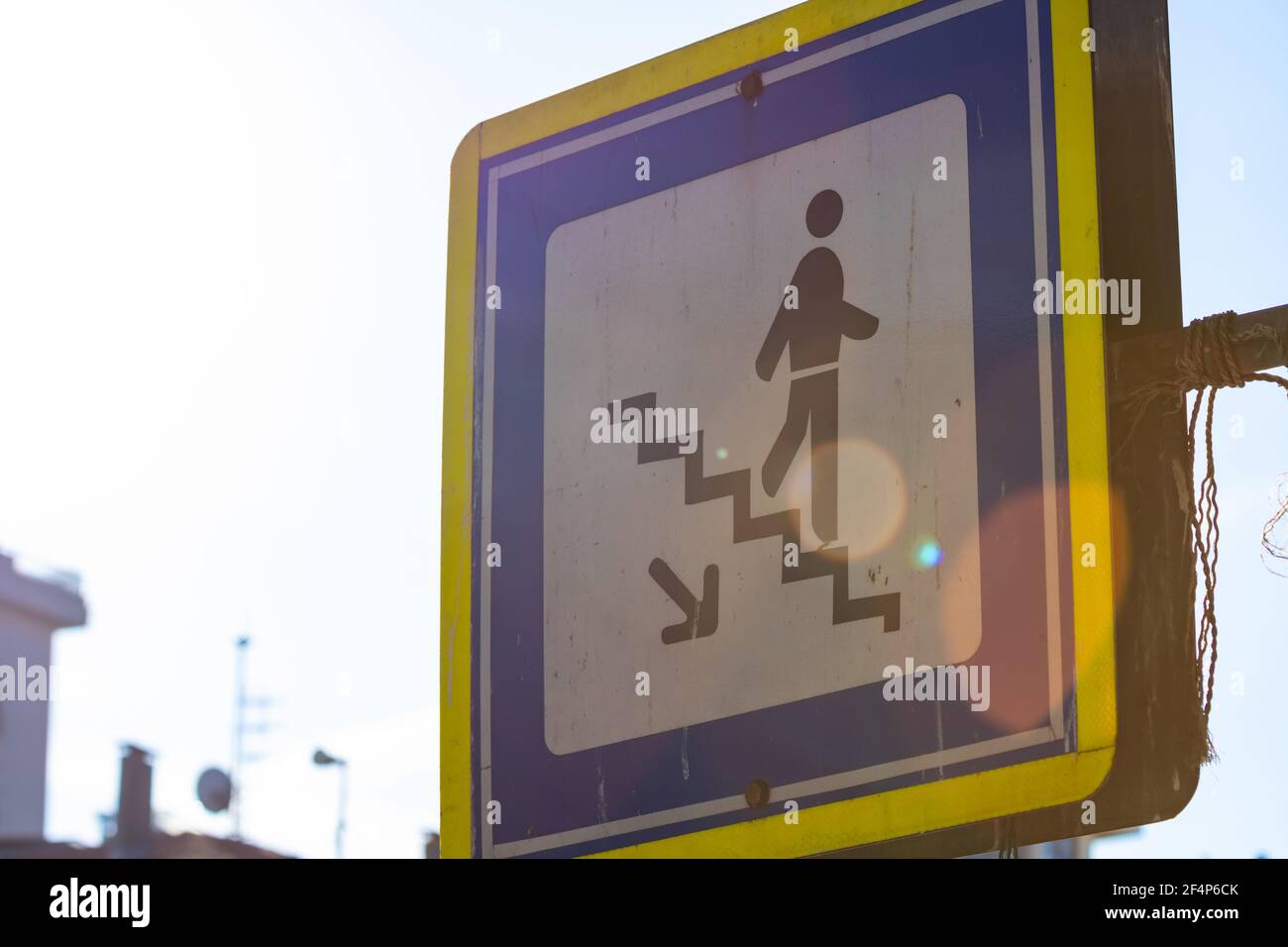 Underpass sign with lens flare. Pedestrian signs in the city. No car ...