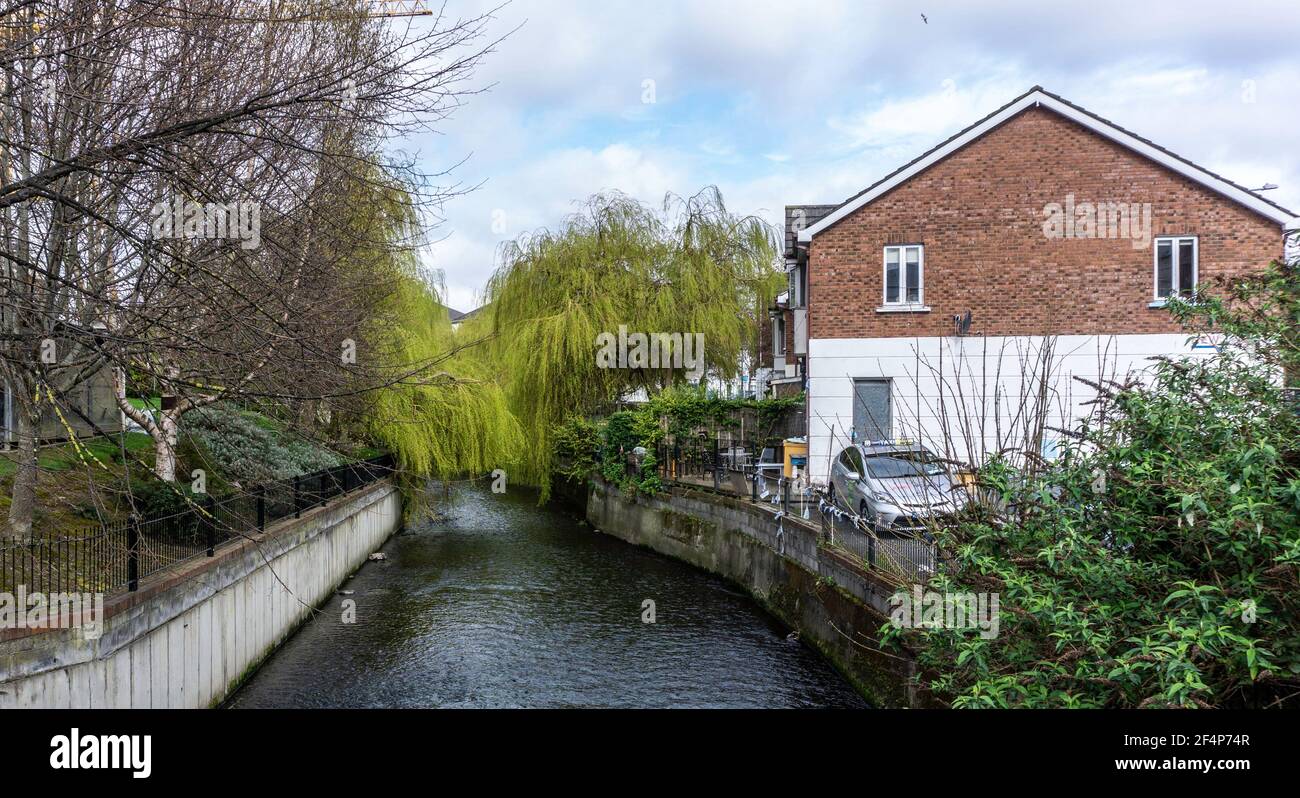 The Camac River, one of the tributaries of the River Liffey seen here ...