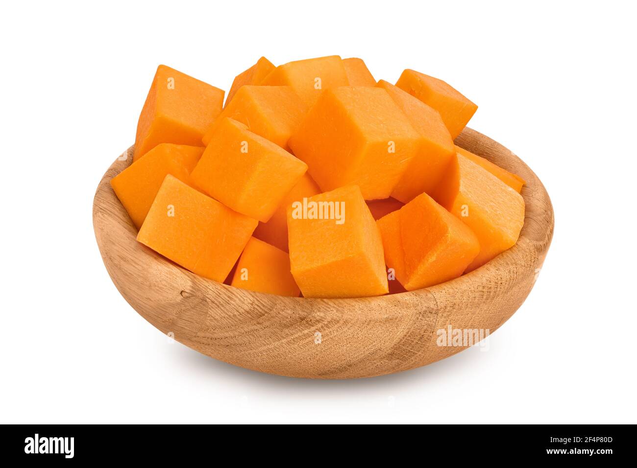 butternut squash diced in wooden bowl isolated on white background with ...