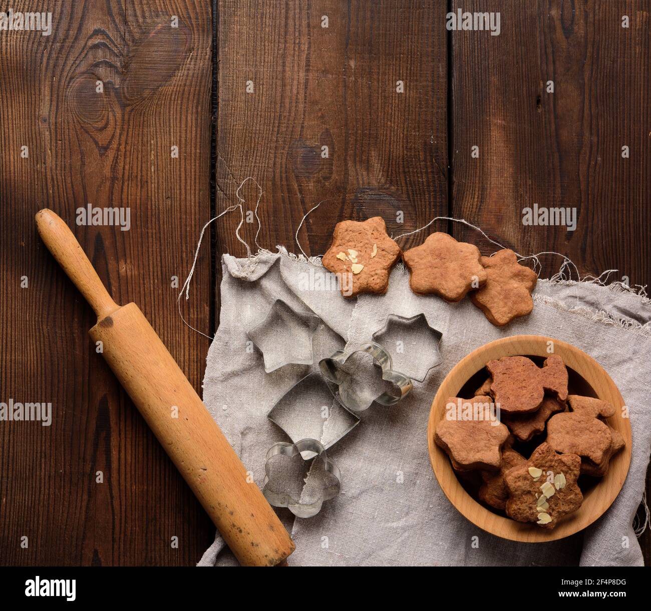 baked star shaped gingerbread cookies, wooden rolling pin and metal ...