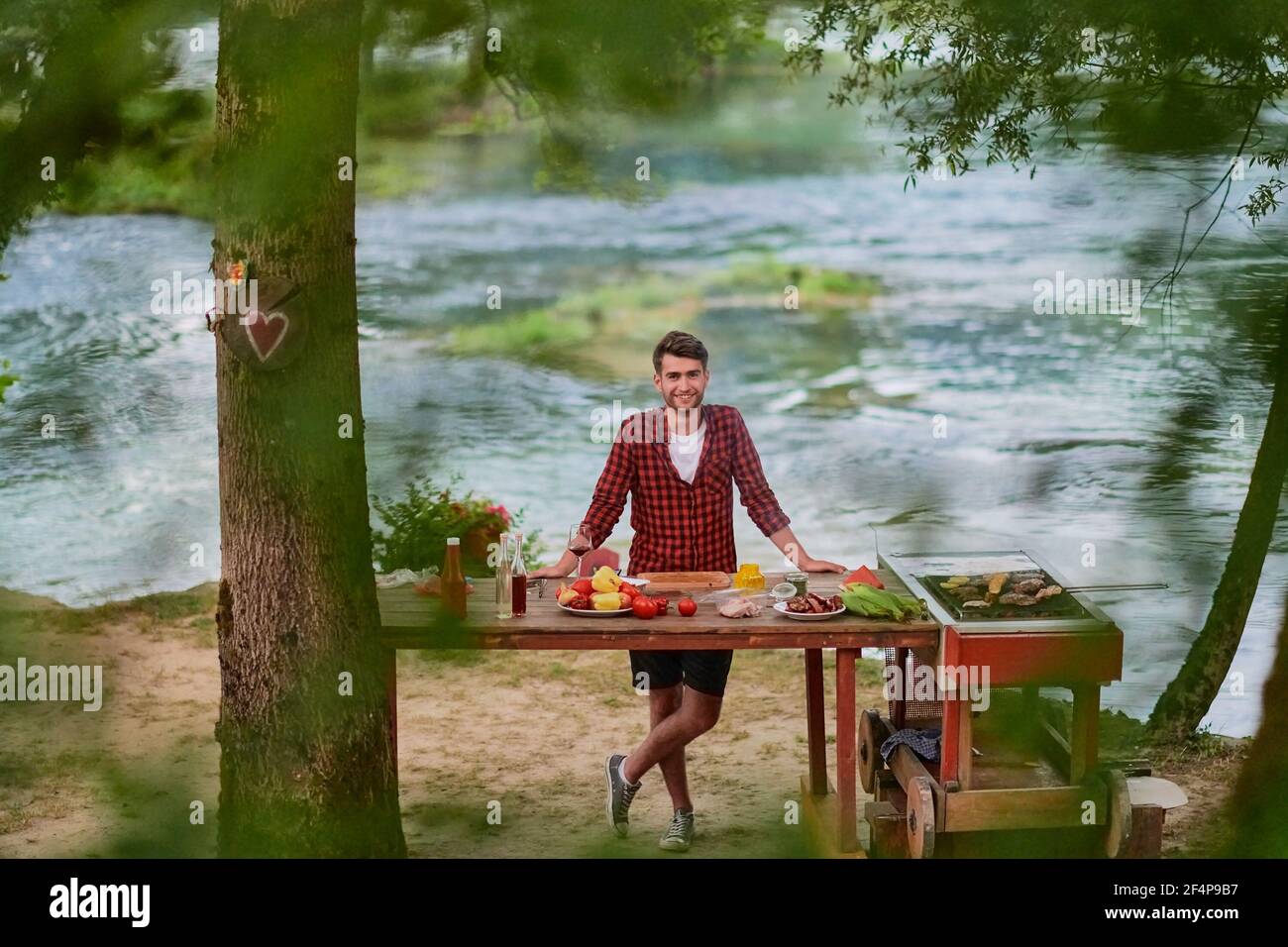 man cooking tasty food for french dinner party Stock Photo - Alamy
