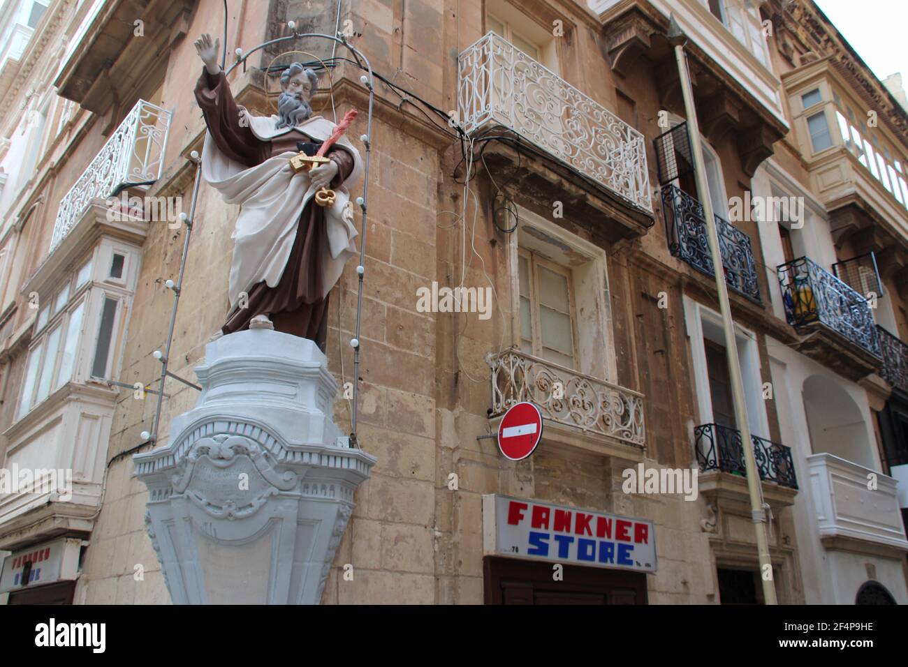 residentialbuildings and statue of a holy character in valletta in ...
