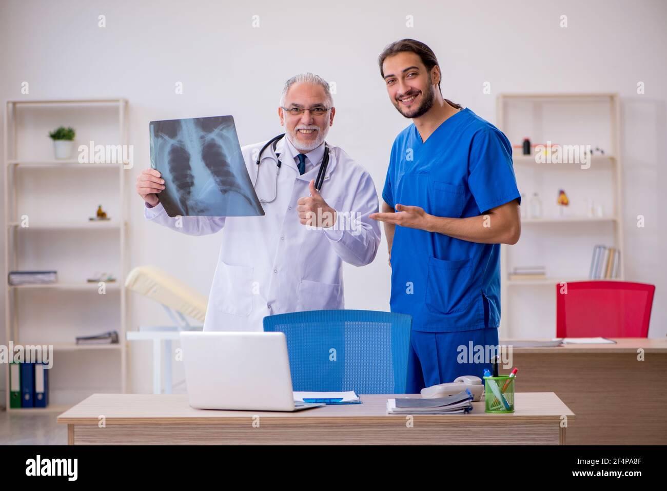 Two doctors working in the hospital Stock Photo - Alamy