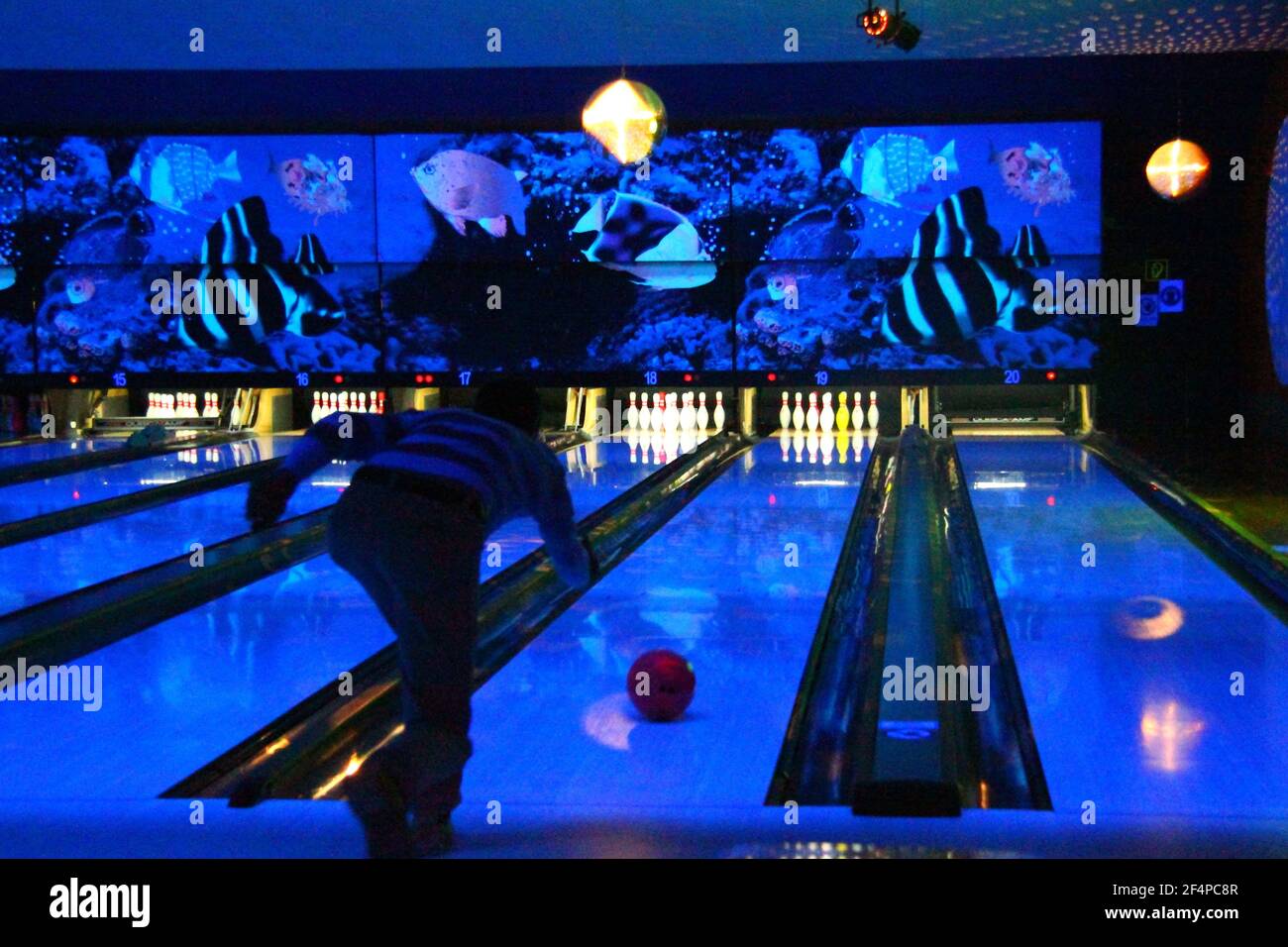 Playing bowling with friends Stock Photo - Alamy