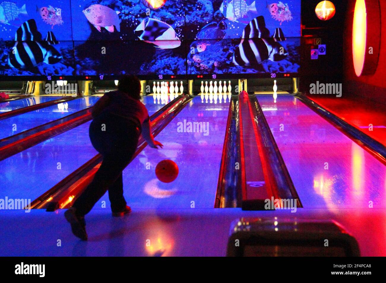 Playing bowling with friends Stock Photo - Alamy