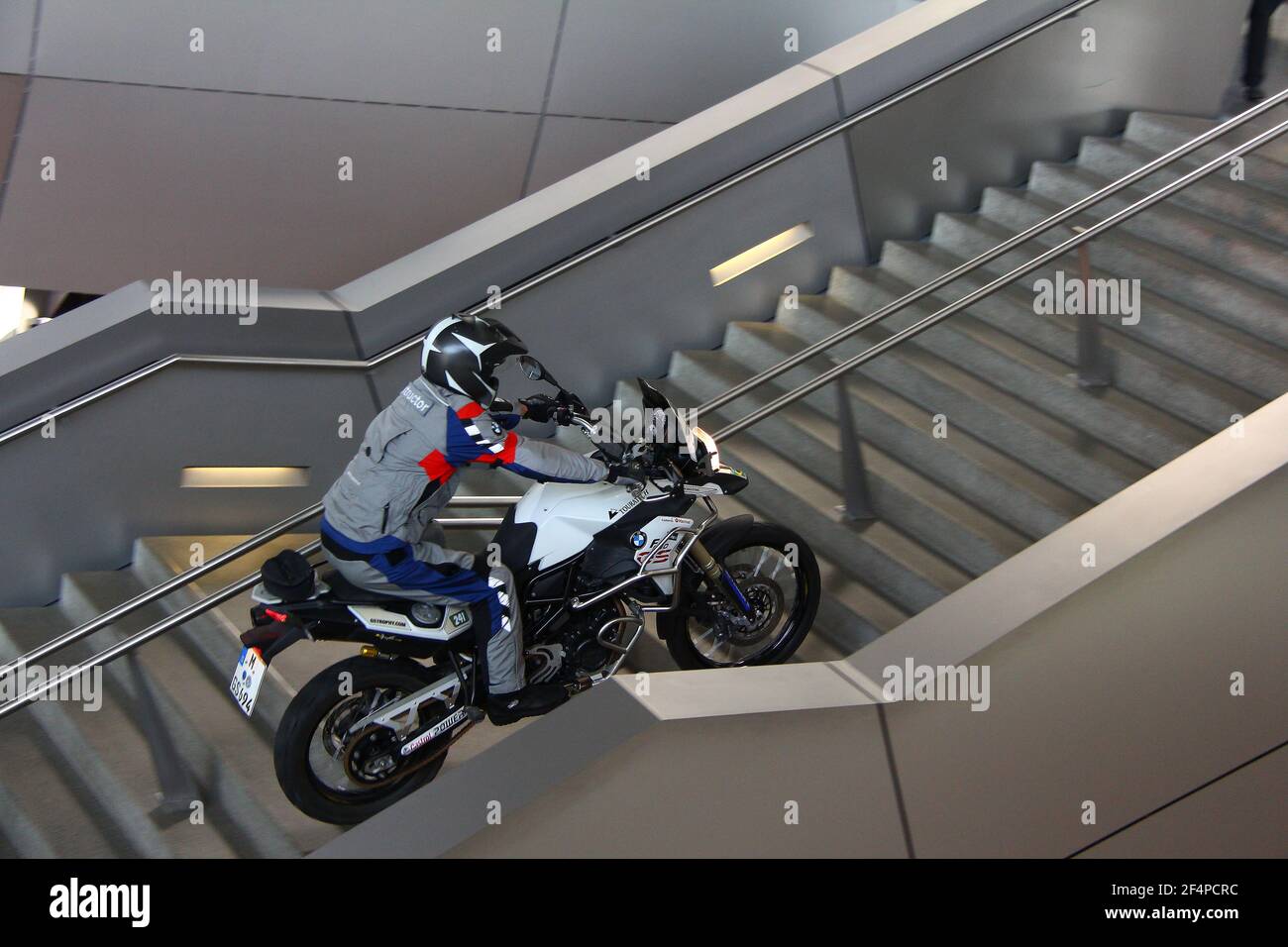 Bikers shows how to run up the stairs with the motorbike Stock Photo ...