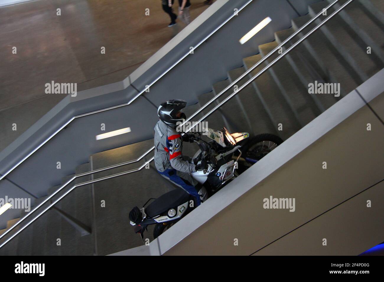 Bikers shows how to run up the stairs with the motorbike Stock Photo ...