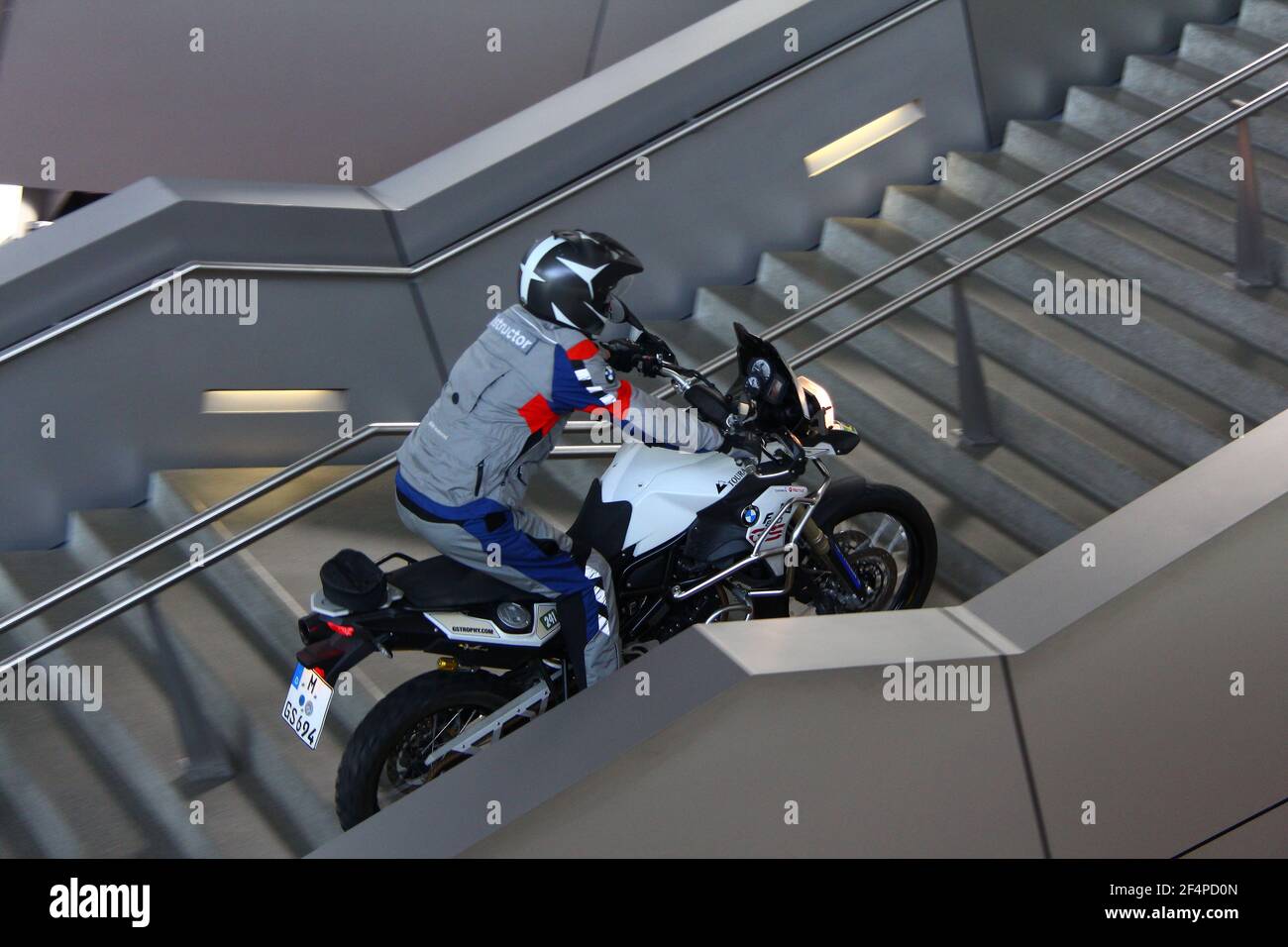 Bikers shows how to run up the stairs with the motorbike Stock Photo ...