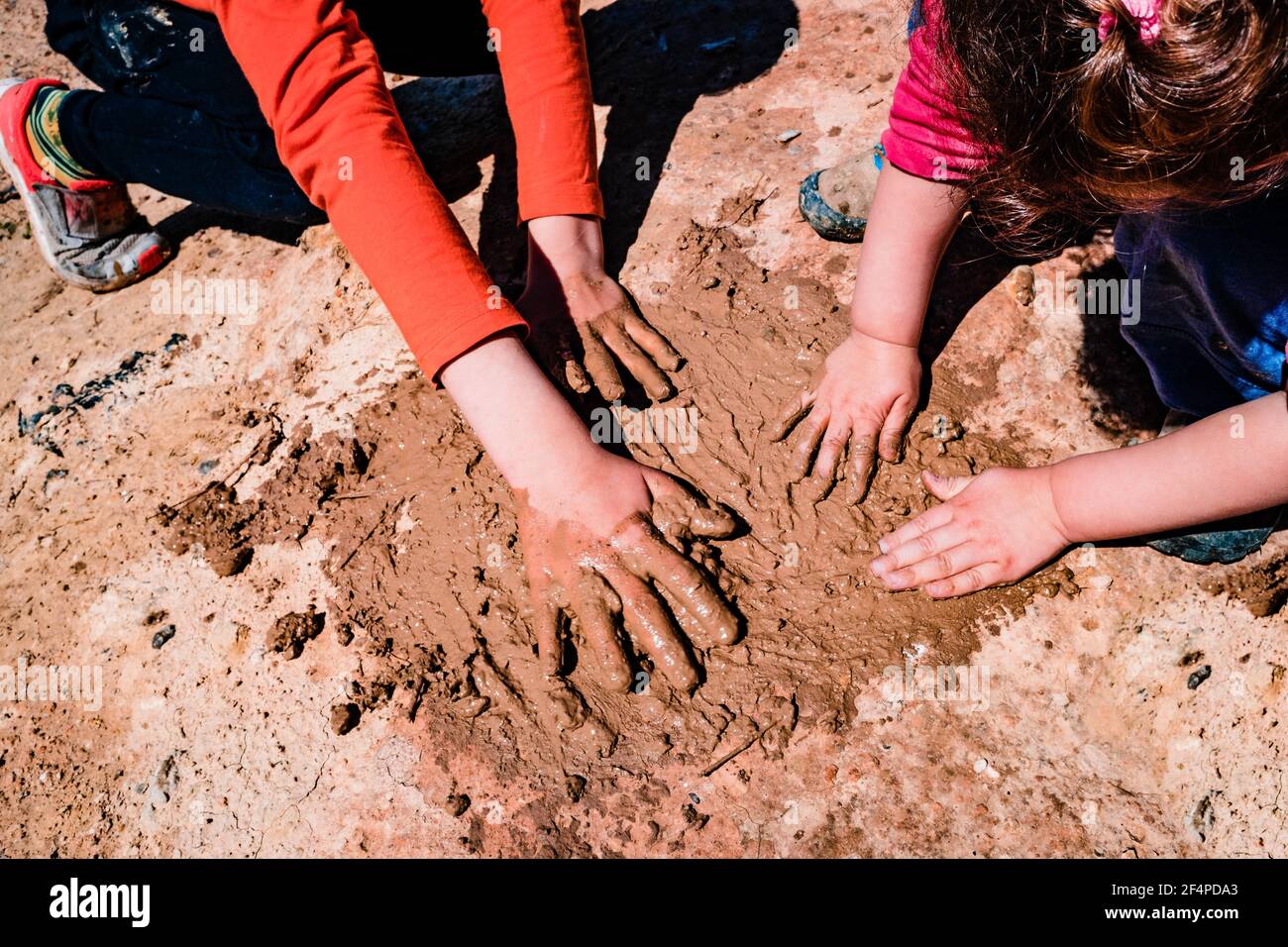 Children play mud outside without worrying about hygiene and microbes ...