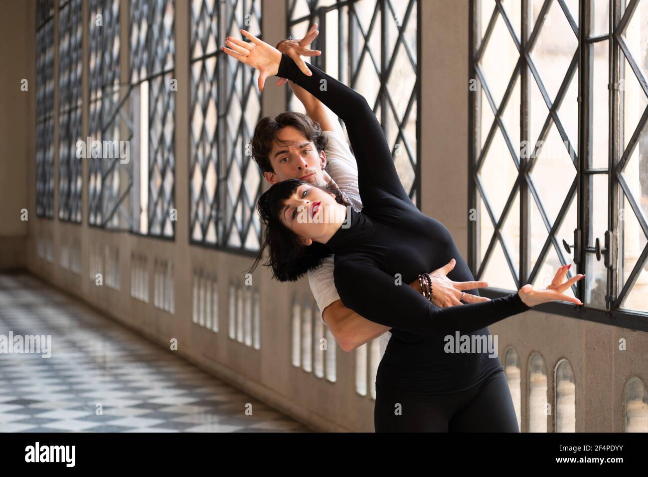 Professional dancers raising arms during rehearsal Stock Photo - Alamy