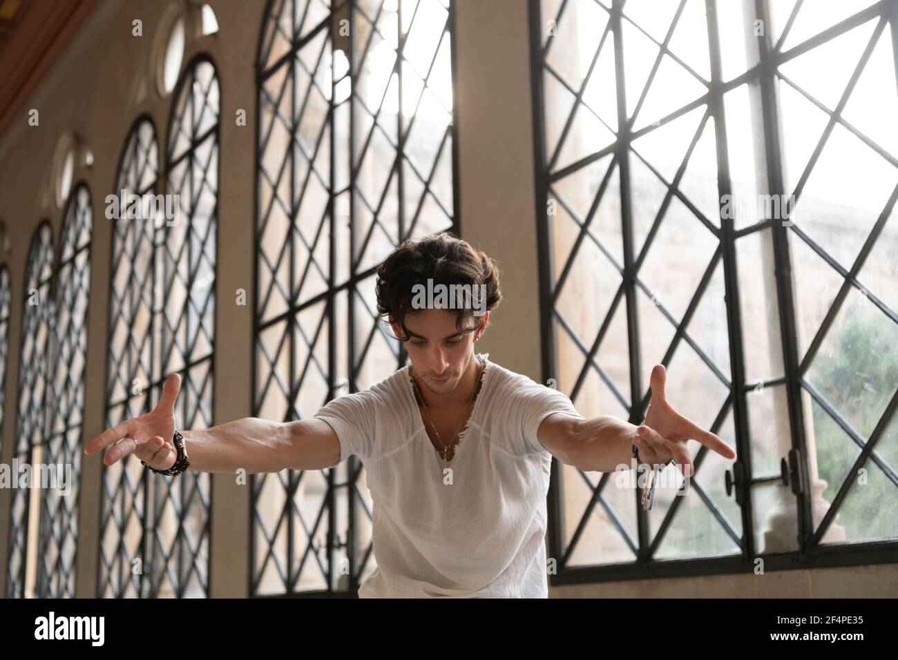 Male dancer stretching arms towards camera Stock Photo - Alamy