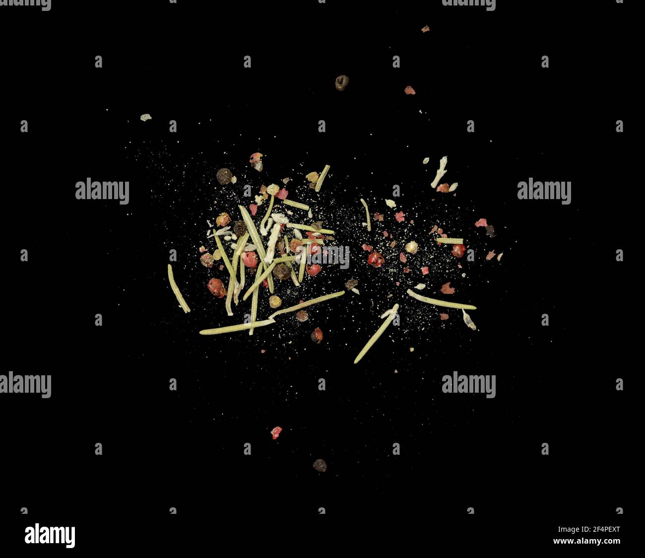 Spices explosion on black background. Dry rosemary and multicolored ...