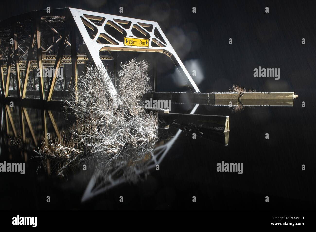 The Flooded Nebraska Bridge At Night in Snowstorm Stock Photo - Alamy