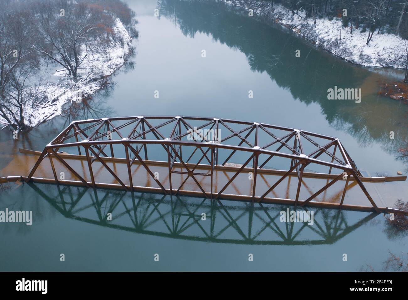 Flooded Bridge in Snowy Mountains from Above Stock Photo - Alamy