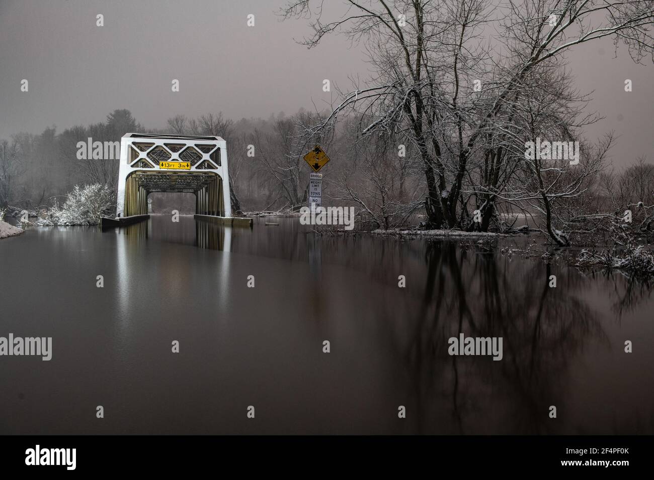 The Flooded Nebraska Bridge At Night in Snowstorm Stock Photo - Alamy