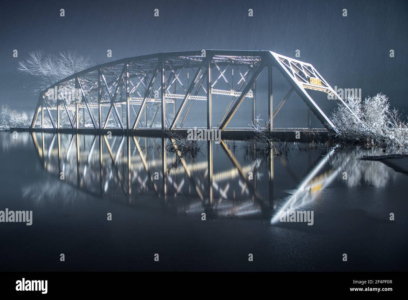 The Flooded Nebraska Bridge At Night in Snowstorm Stock Photo - Alamy