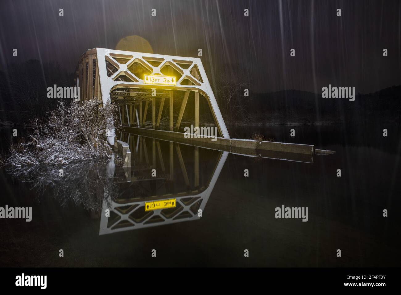 The Flooded Nebraska Bridge At Night in Snowstorm Stock Photo - Alamy