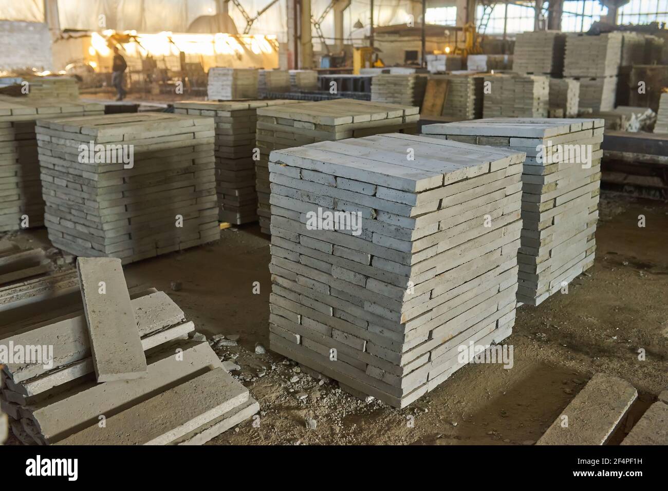 Paving slabs factory. Tiles piled in pallets. Warehouse paving slabs in ...