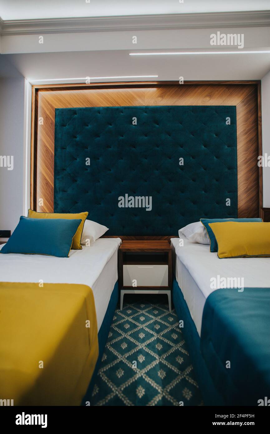 Beautiful hotel room with a wooden interior design and two single-sided ...