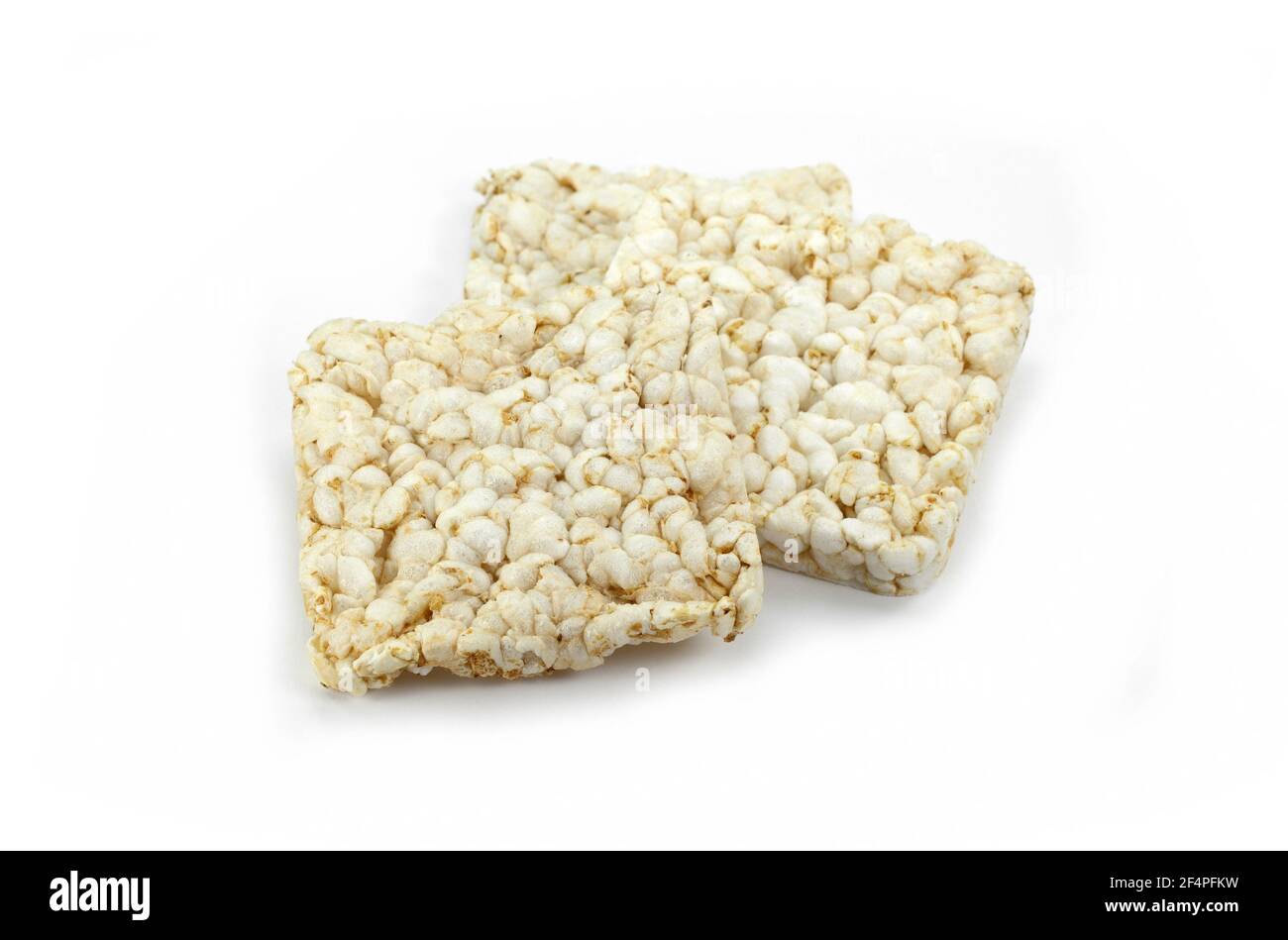 Puffed rice cakes isolated on white. Stack of puffed whole grain ...