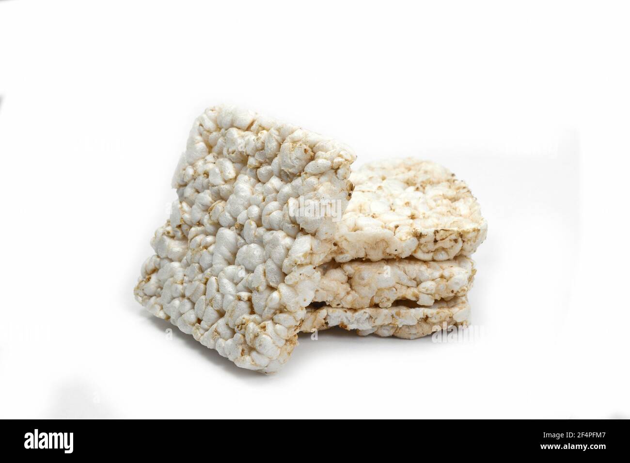 Puffed rice cakes isolated on white. Stack of puffed whole grain ...