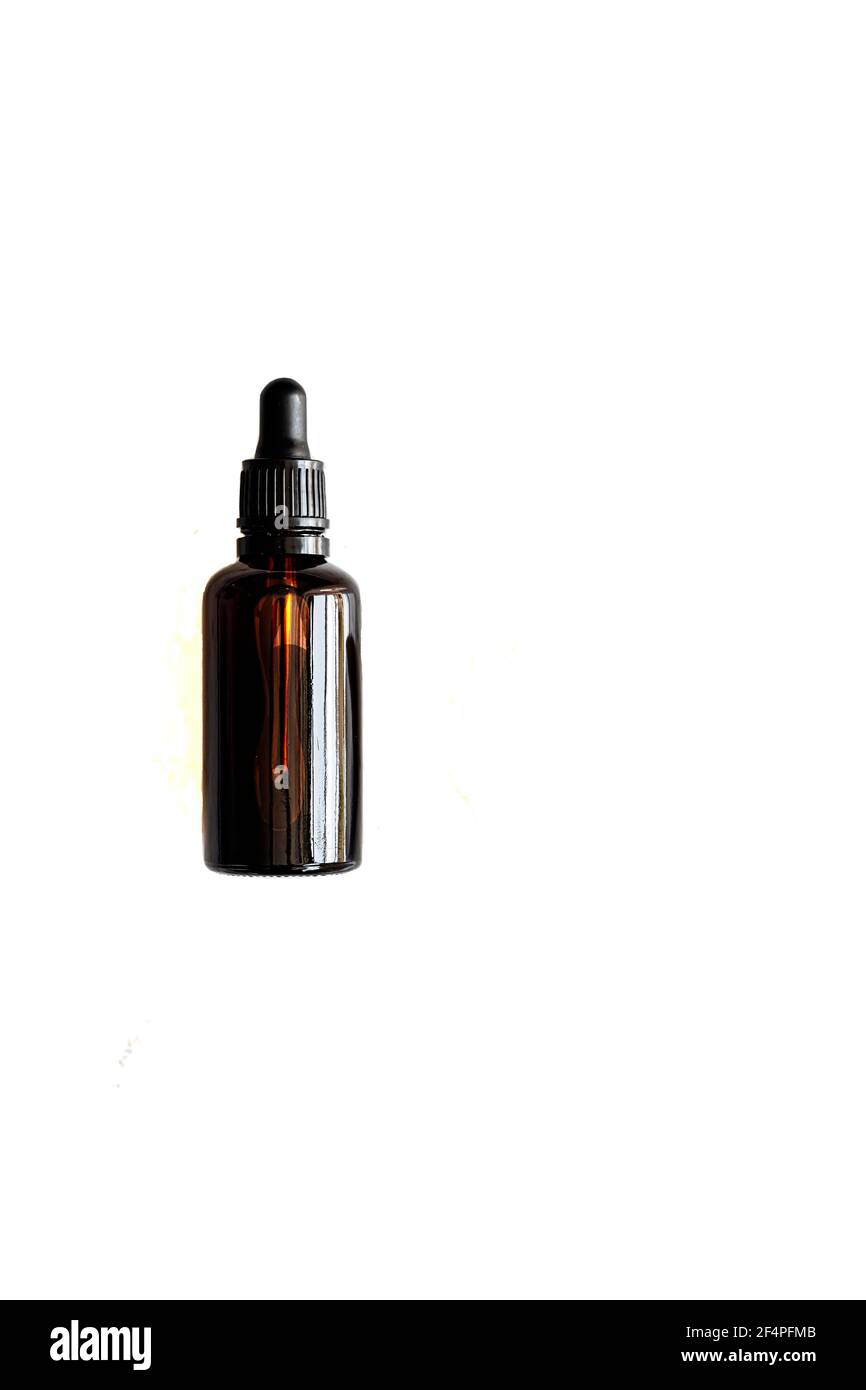 Dark brown dropper bottle isolated on white background Stock Photo - Alamy