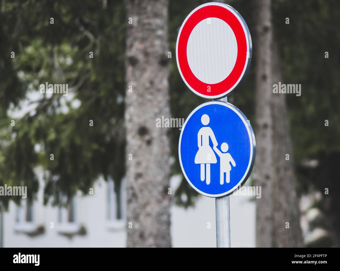 Selective focus shot of street signs such as the "Stop" sign and ...