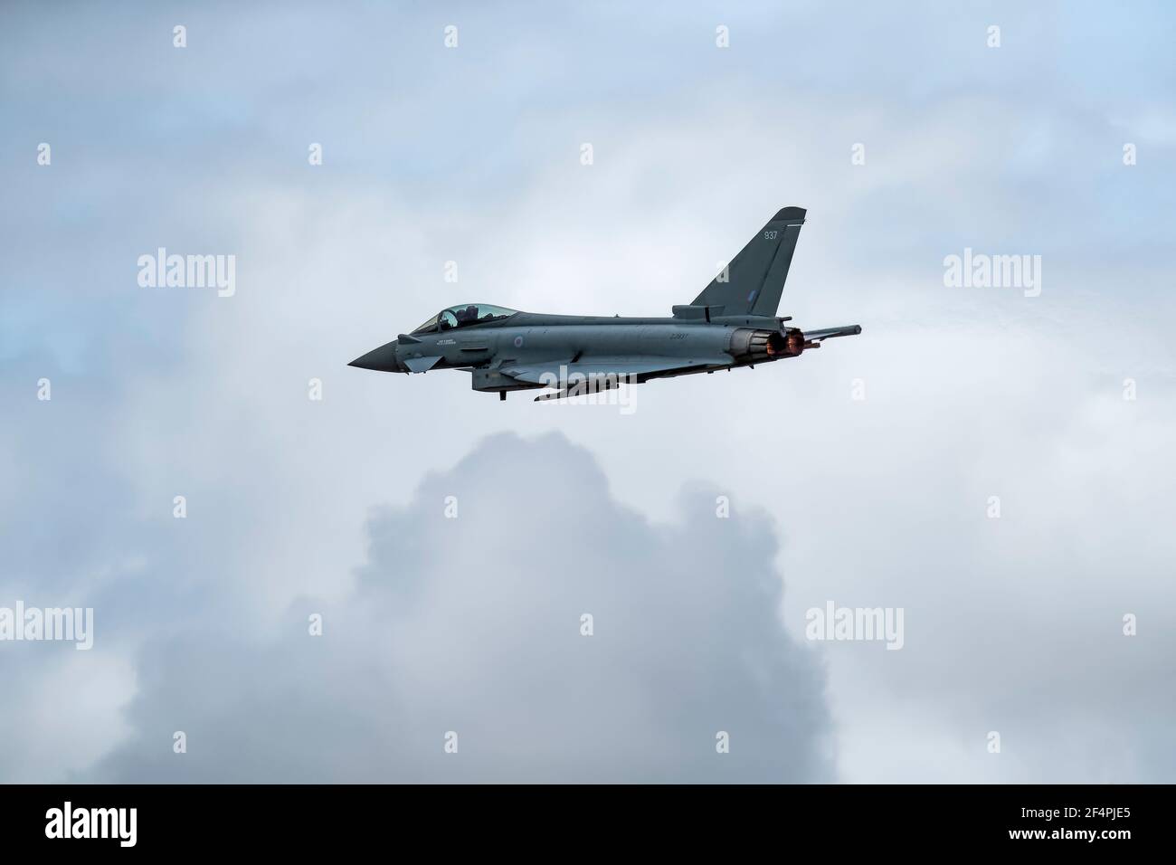 RAF Typhoon Jet in flight in sky with clouds Stock Photo - Alamy