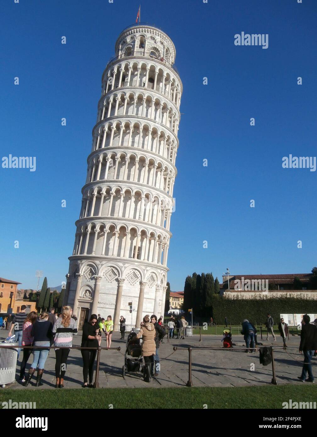 Pisa, Italy. Leaning Tower of Pisa with sunset light and blue sky on ...