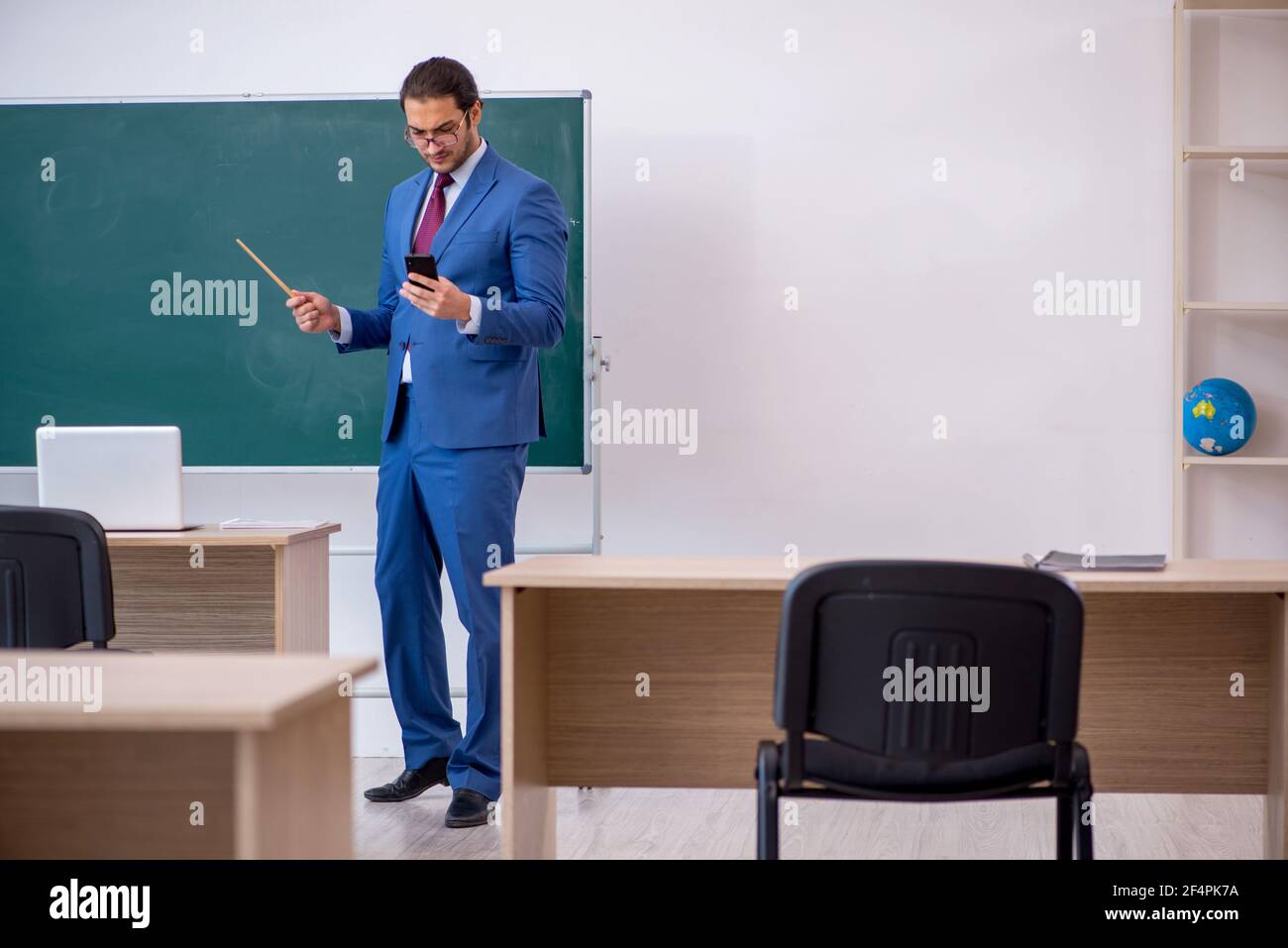 Teacher showing video in classroom hi-res stock photography and images ...