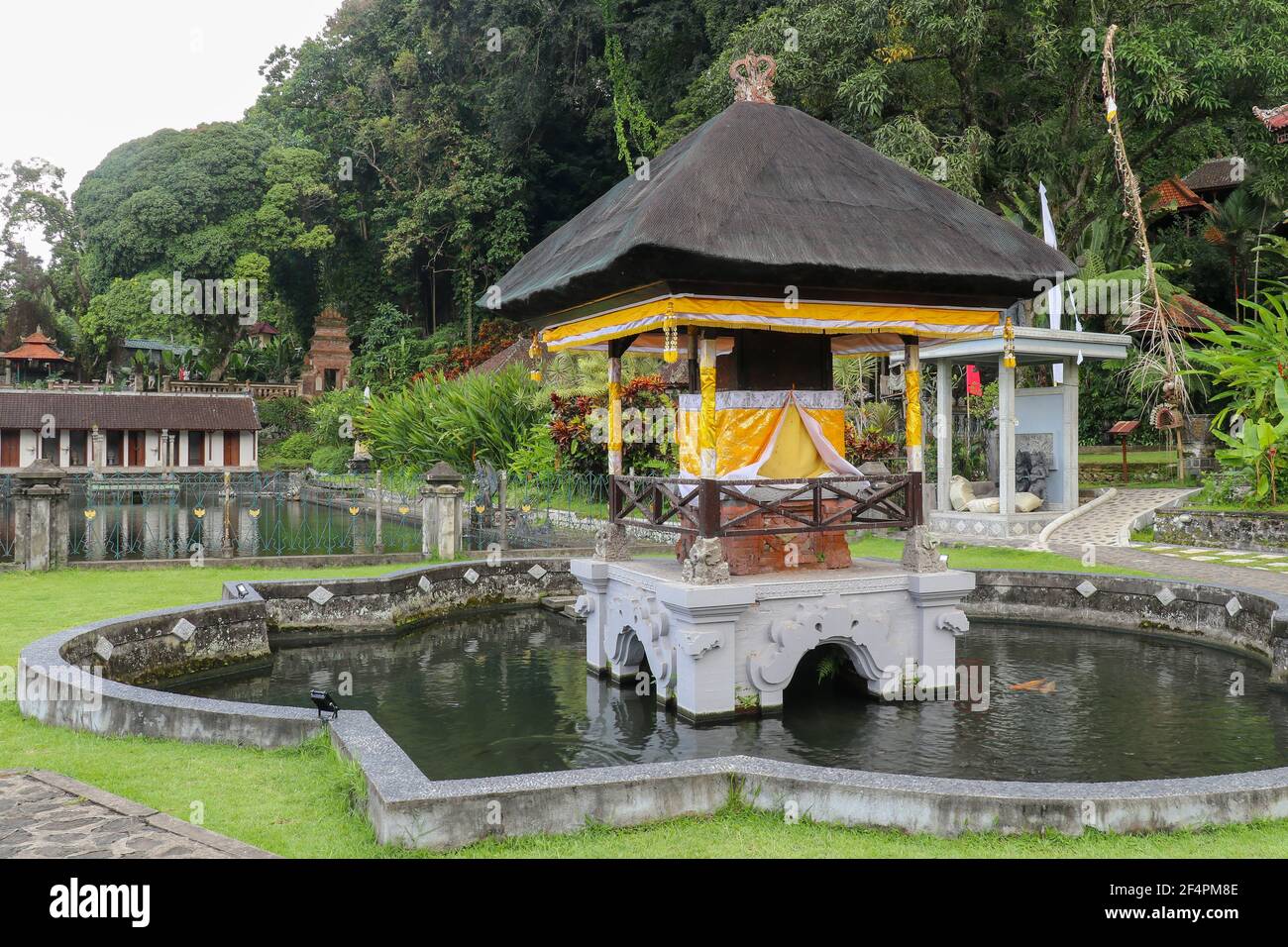 Tropical park around the pond in Tirta Gangga complex, Bali, Indonesia ...