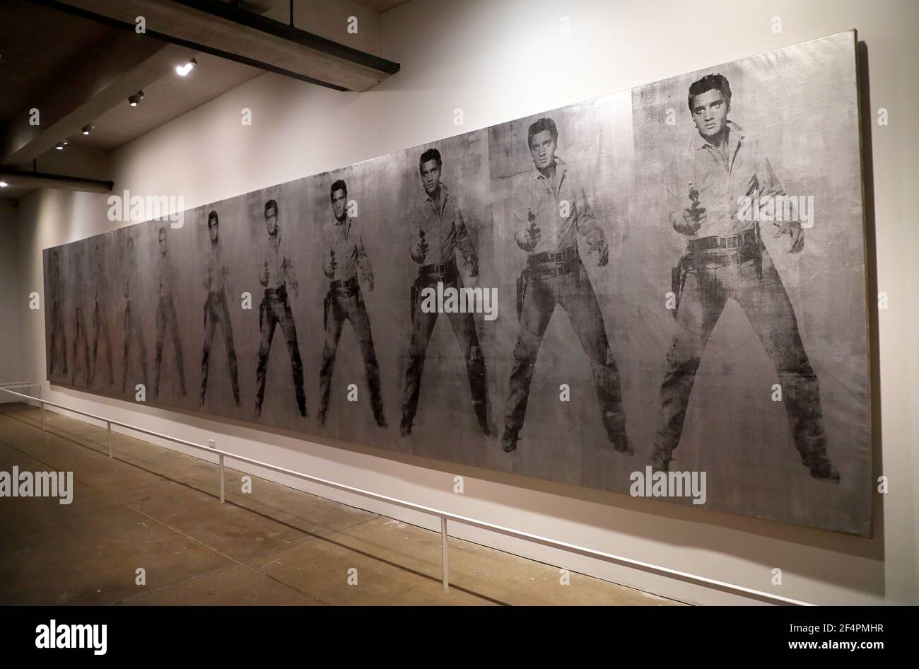 Elvis 11 Times (Studio Type)1963, a silkscreen ink and silver paint on linen by Andy Warhol ...