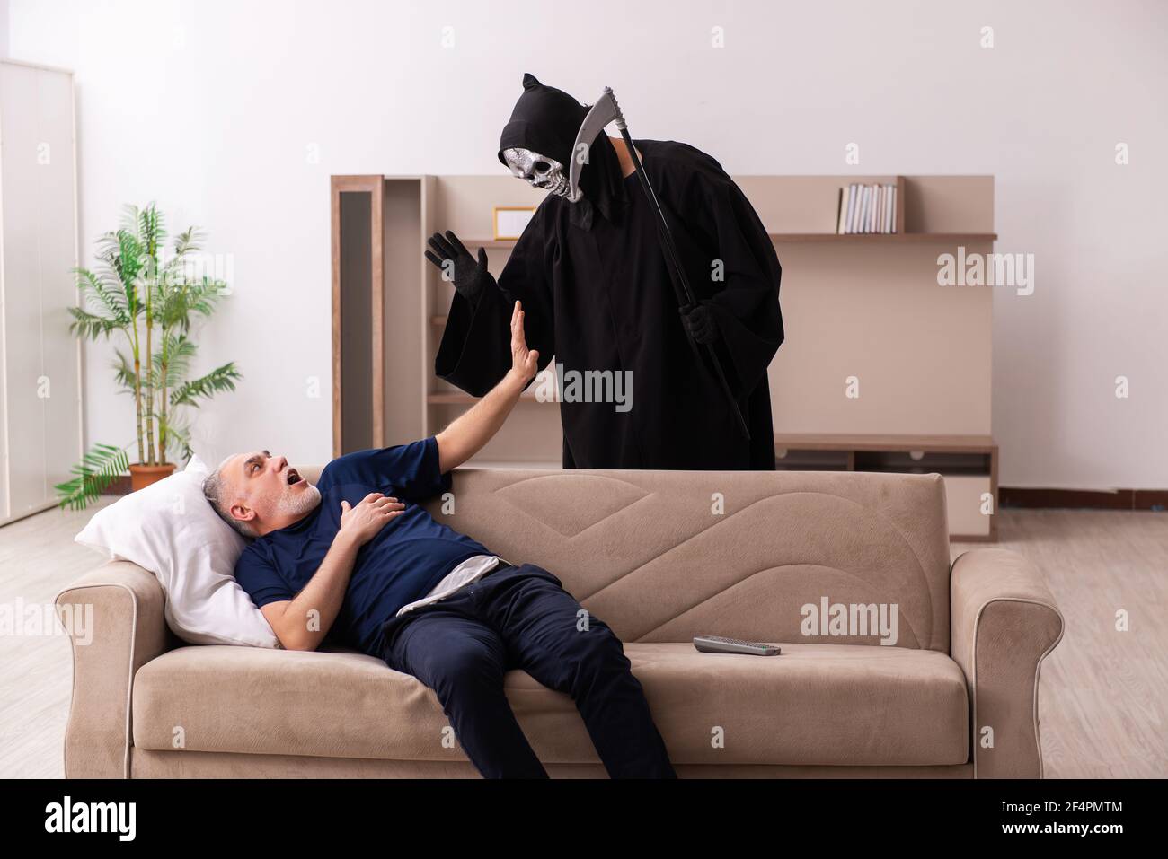 Devil coming to old dying man Stock Photo - Alamy