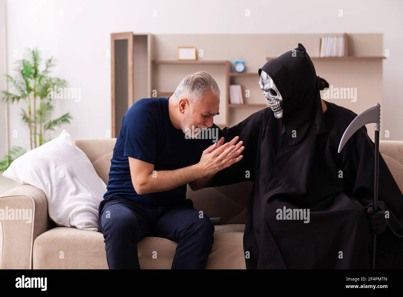 Devil coming to old dying man Stock Photo - Alamy