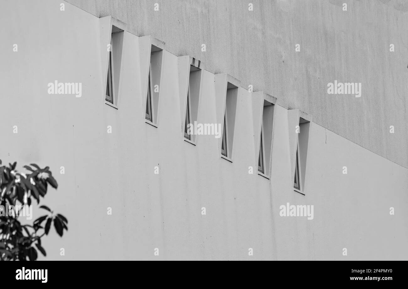 6 small windows bring light into a large building Stock Photo - Alamy