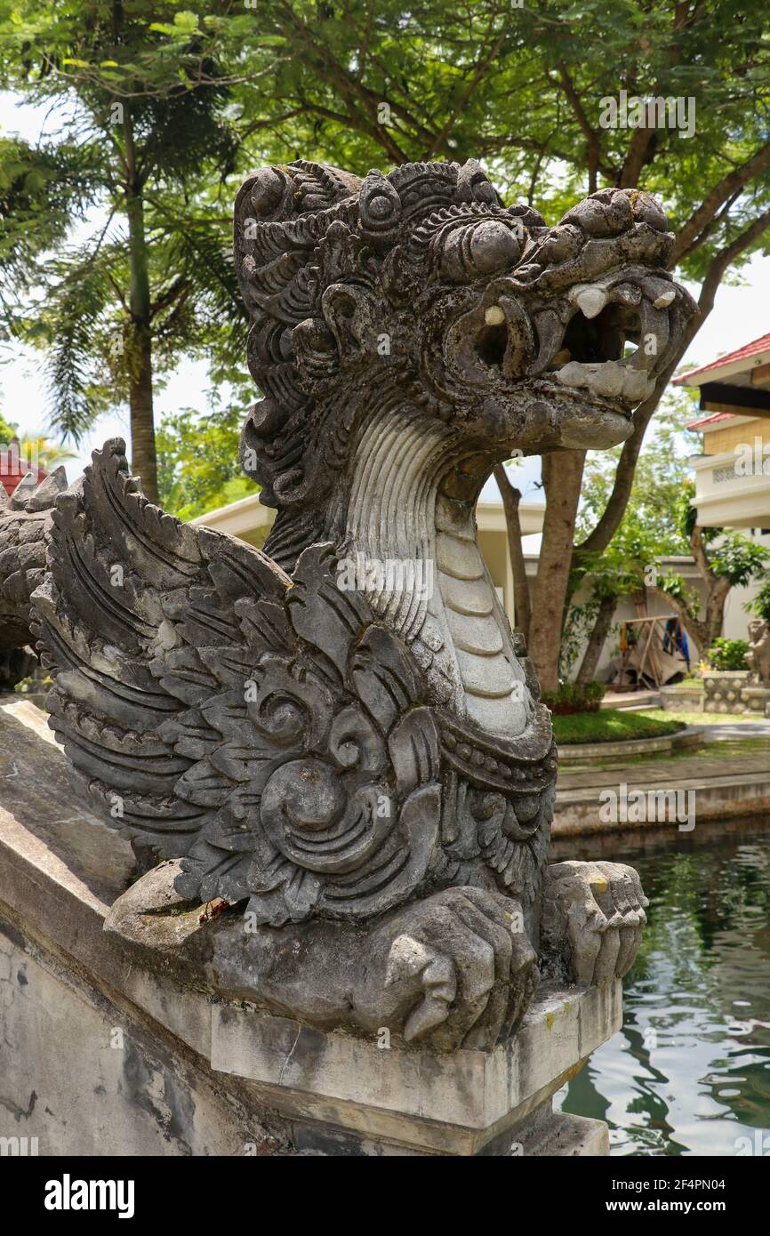 Dragon statue in Water Palace of Tirta Gangga East Bali, Indones Stock ...