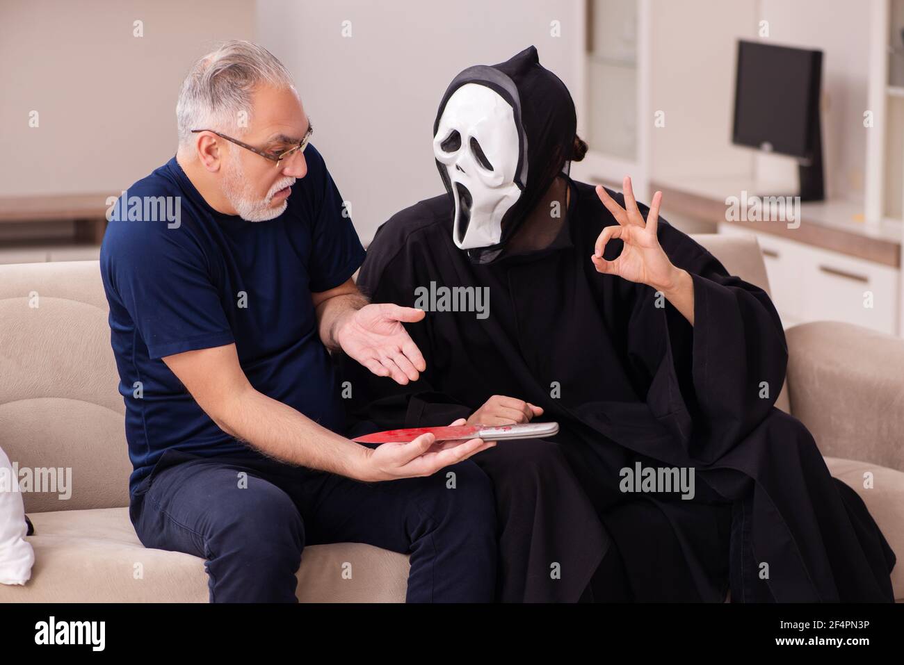 Devil coming to old dying man Stock Photo - Alamy