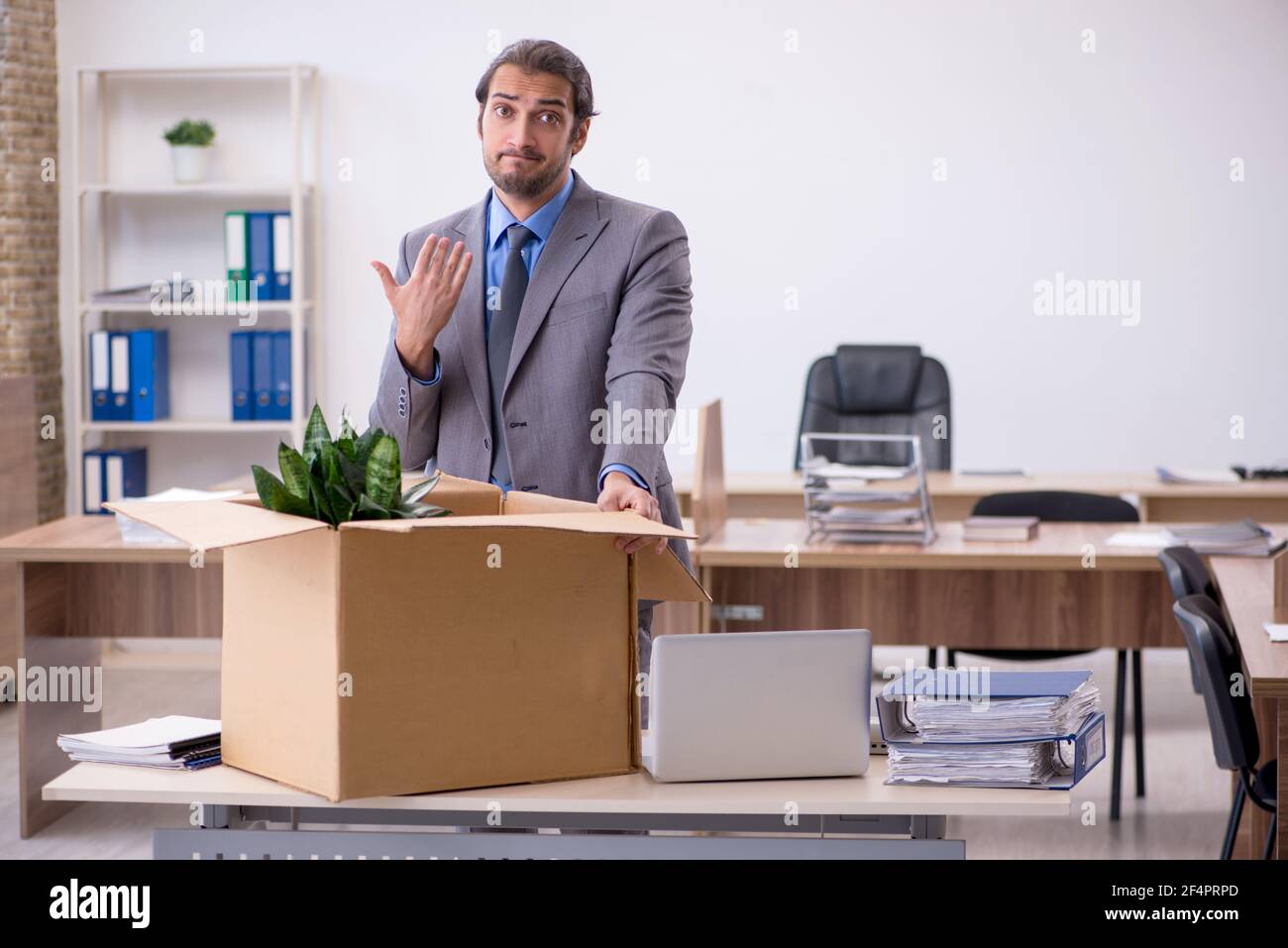 Young employee being fired from his work Stock Photo - Alamy